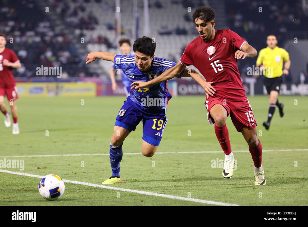 (L-R) Mao Hosoya (JPN), Jassem Gaber (QAT) APRIL 25, 2024 - Football ...