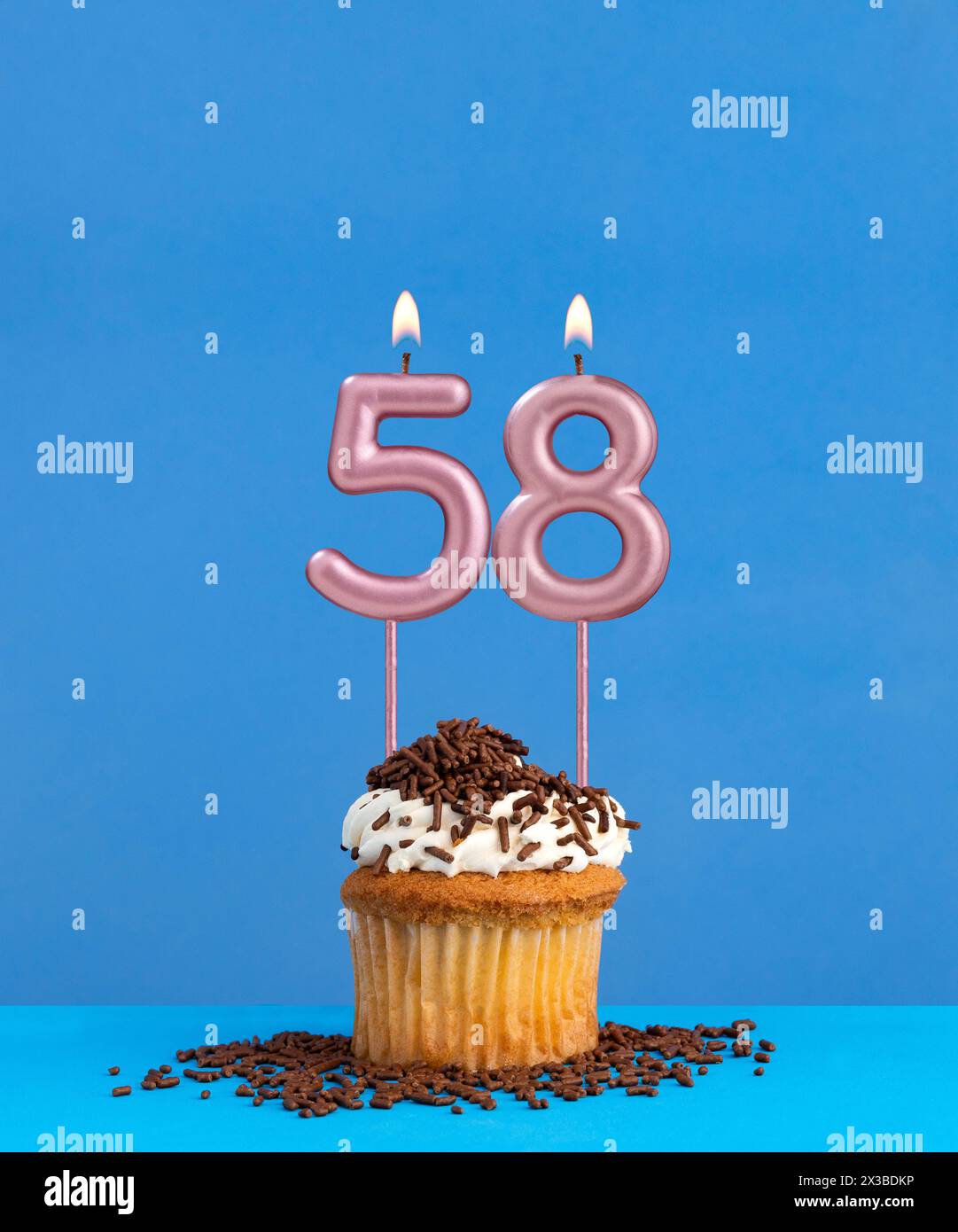 Candle number 58 - Birthday card with cupcake on blue background Stock ...