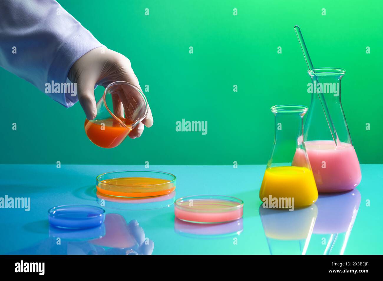 Liquid purification in the laboratory with a scientist holding a beaker ...