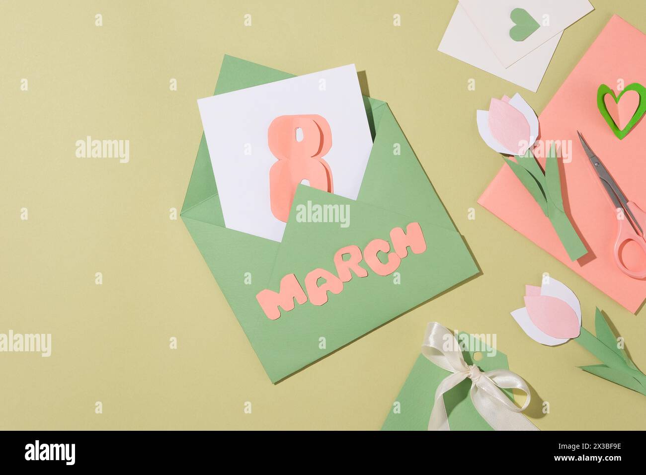 An envelope with a card printed the number 8 inside and the word “March ...