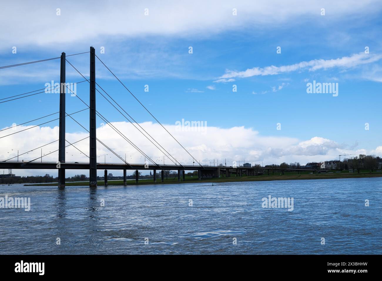 View over the Rhine with bridge, behind Oberkassel, Duesseldorf ...