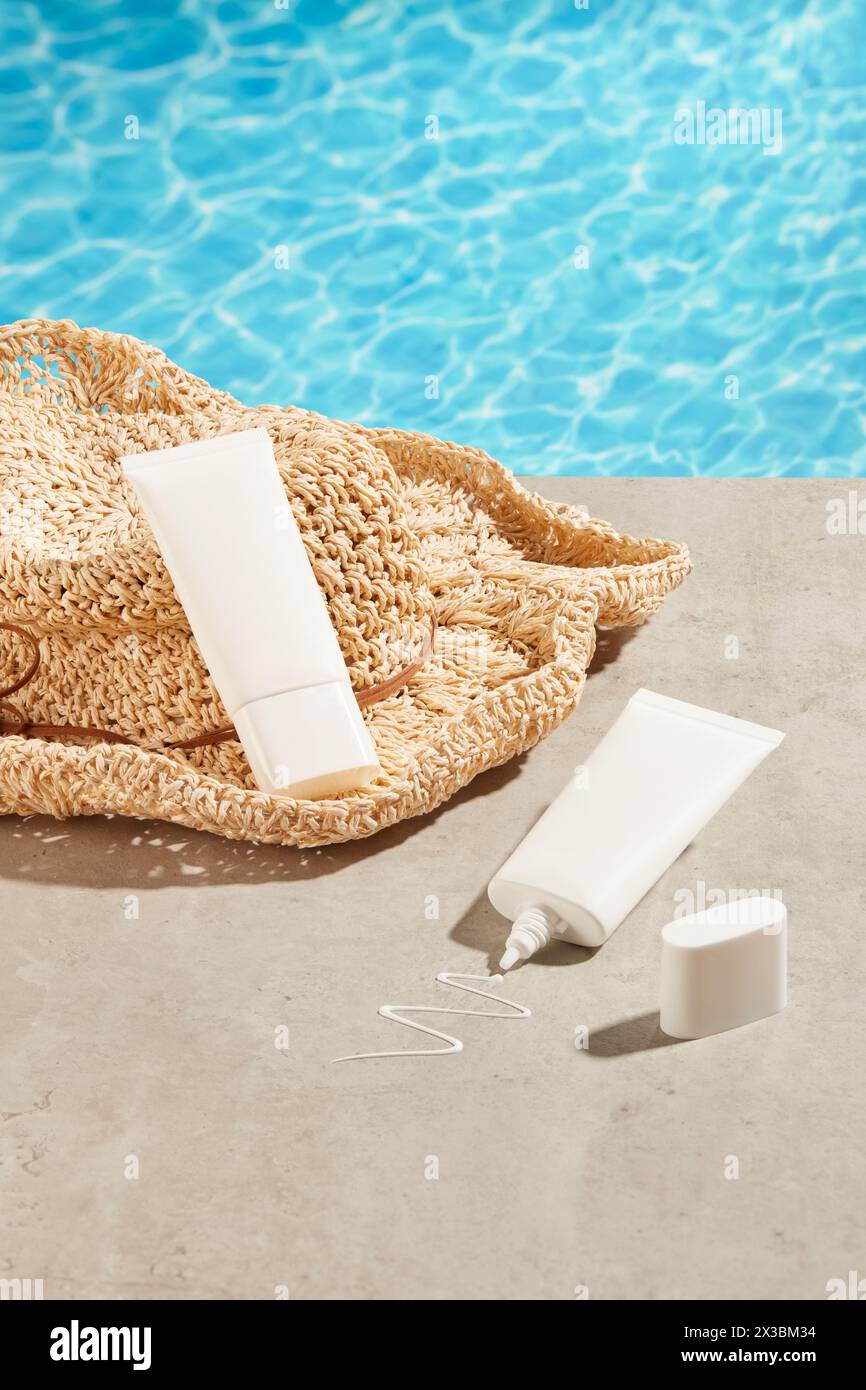 A smear of sunscreen decorated on concrete surface with two blank label ...