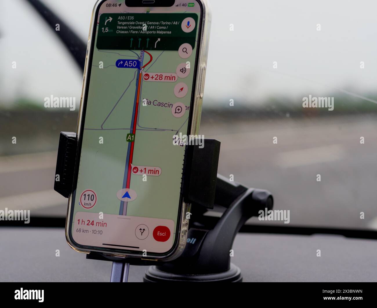 Smartphone displaying GPS navigation mounted on a car's dashboard, A1 ...