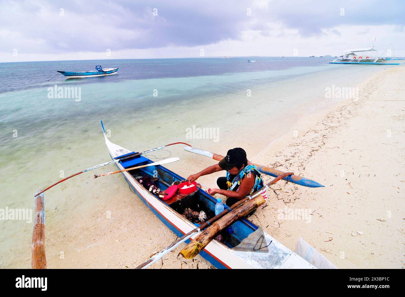 Sea Urchin fishing on a banca boat. Malapascua Island, Central Visayas ...