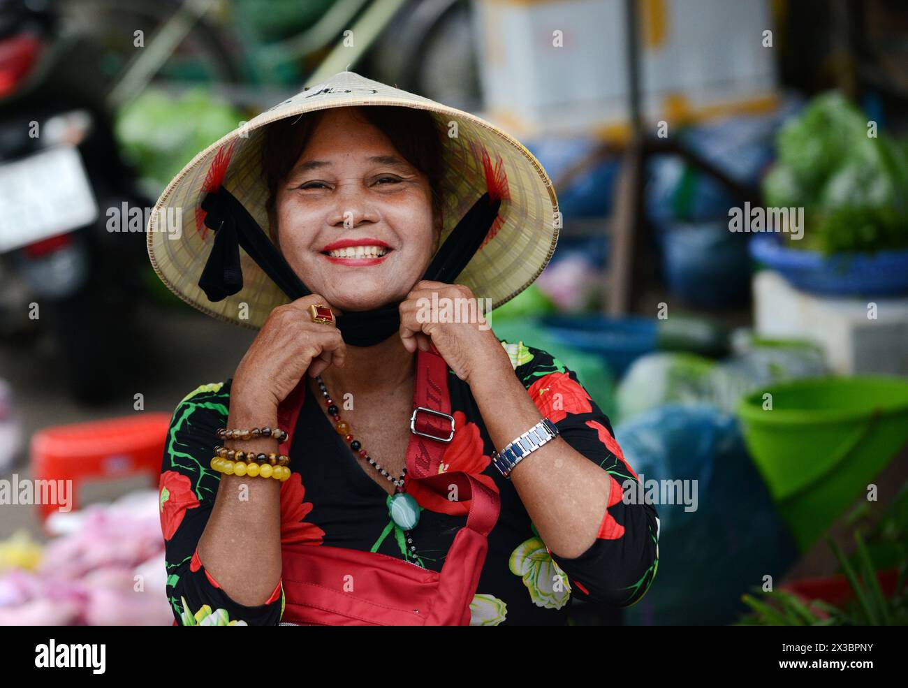Portrait of a smiling Vietnamese woman taken at the central market in ...