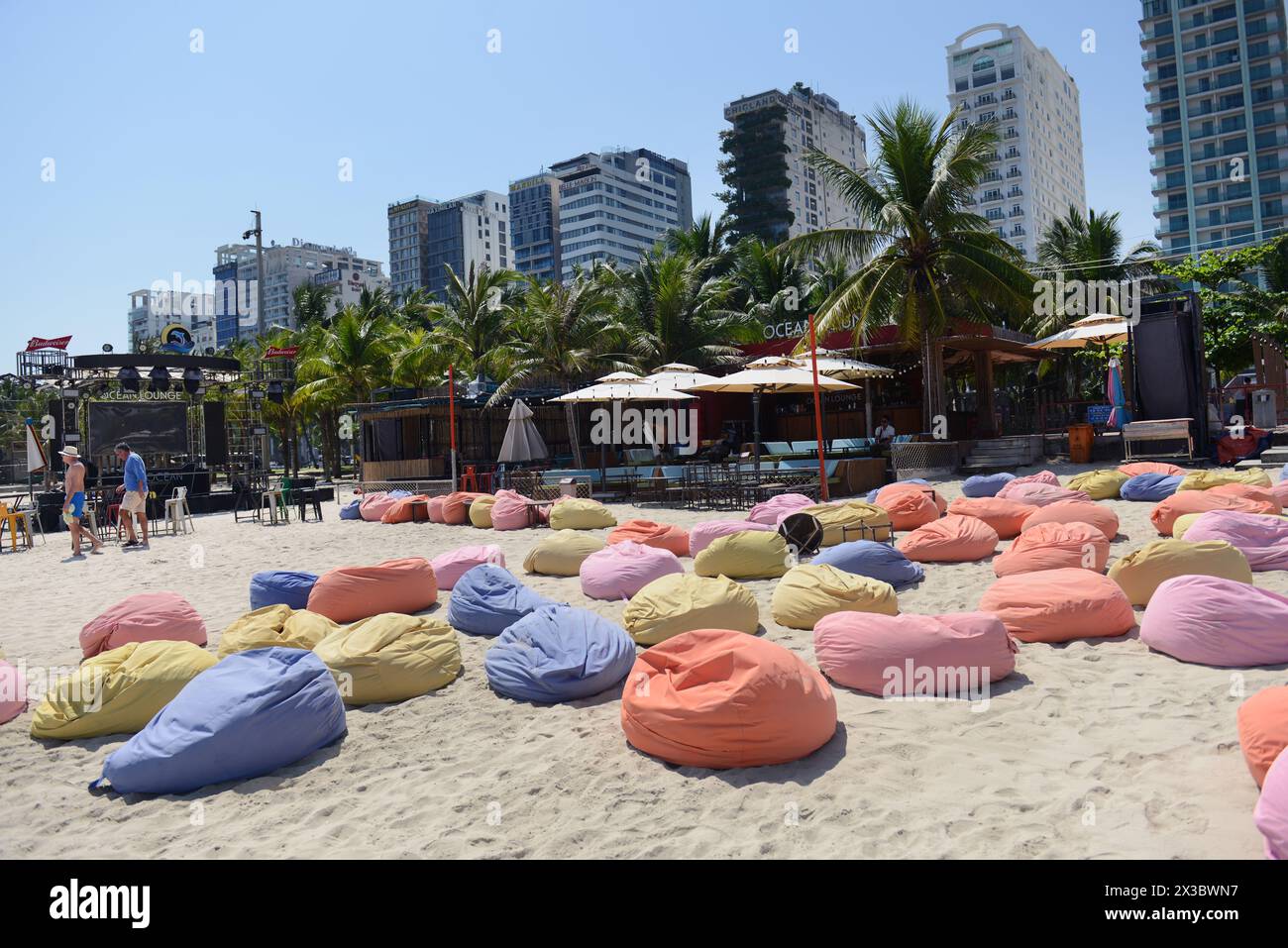 The beautiful long white sand beach along the changing waterfront ...