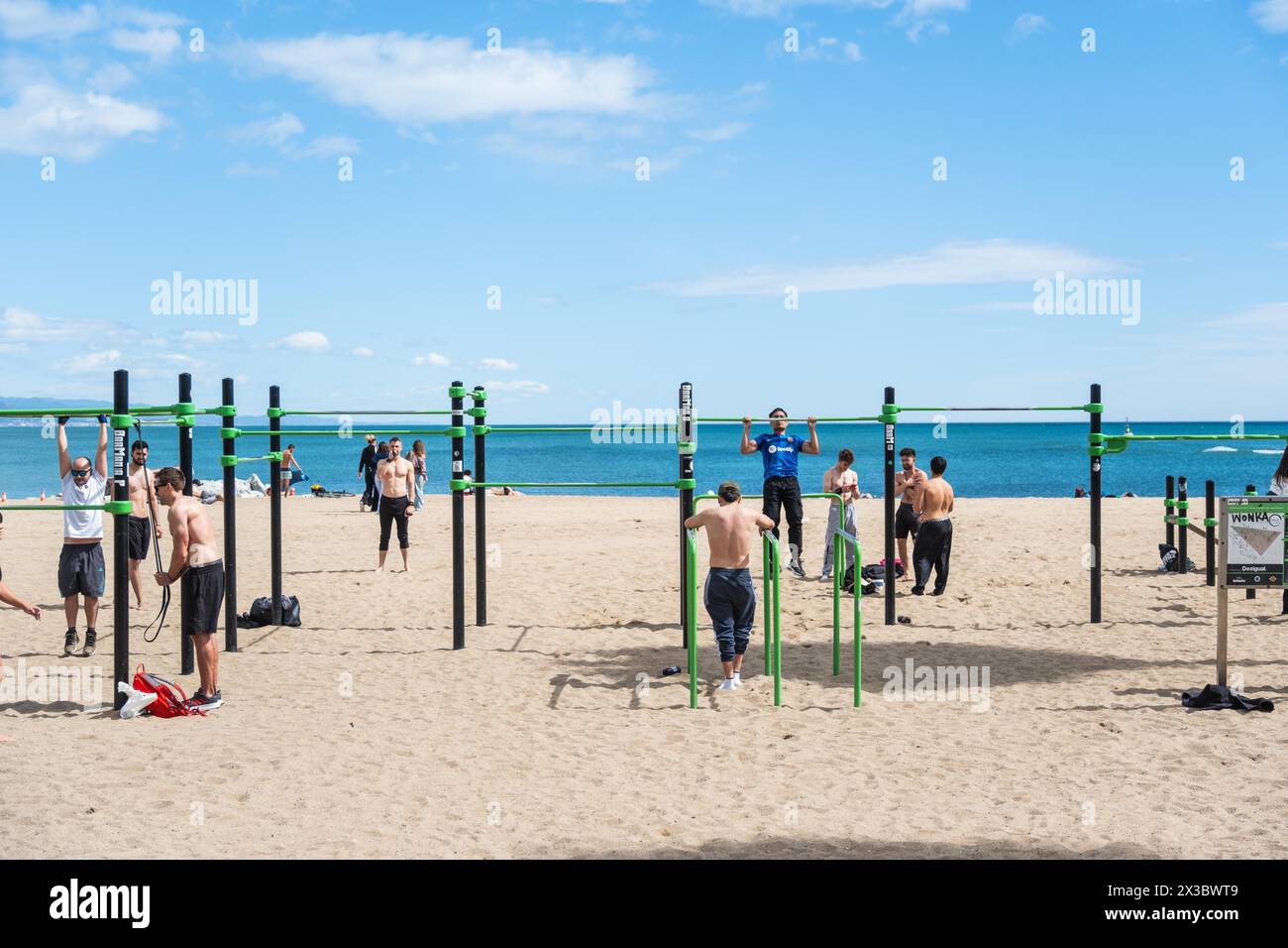 Outdoor gym with athletes on the city beach in Barcelona, Spain Stock ...