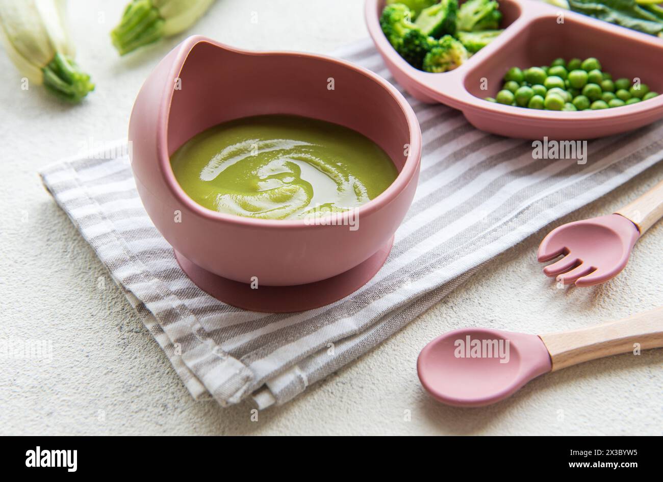 Healthy baby food in bowl. Baby food vegetable puree with broccoli and ...