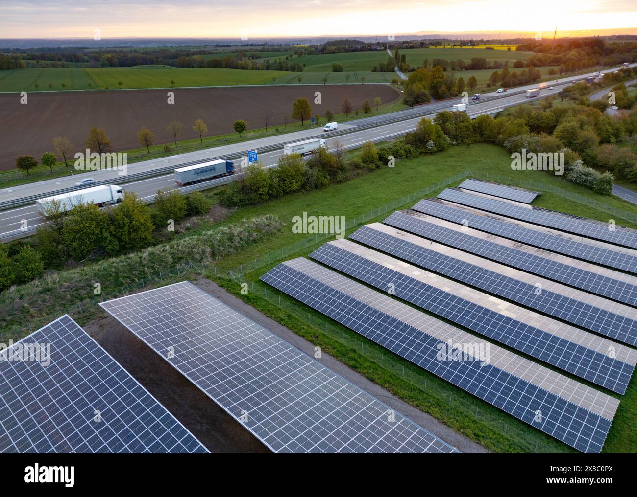 Wilsdruff, Germany. 26th Apr, 2024. A solar park is located on the ...