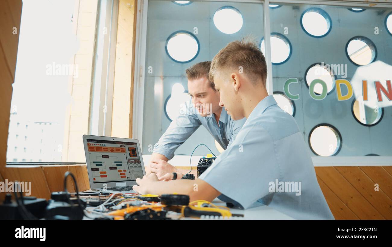 Smart student present coding program and car model to skilled teacher ...