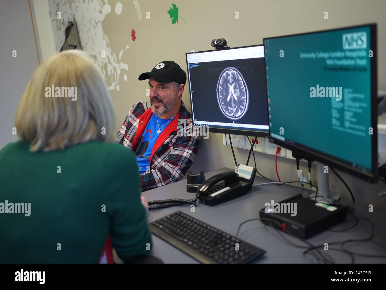 Consultant Dr Heather Shaw speaking to patient Steve Young, with an MRI ...