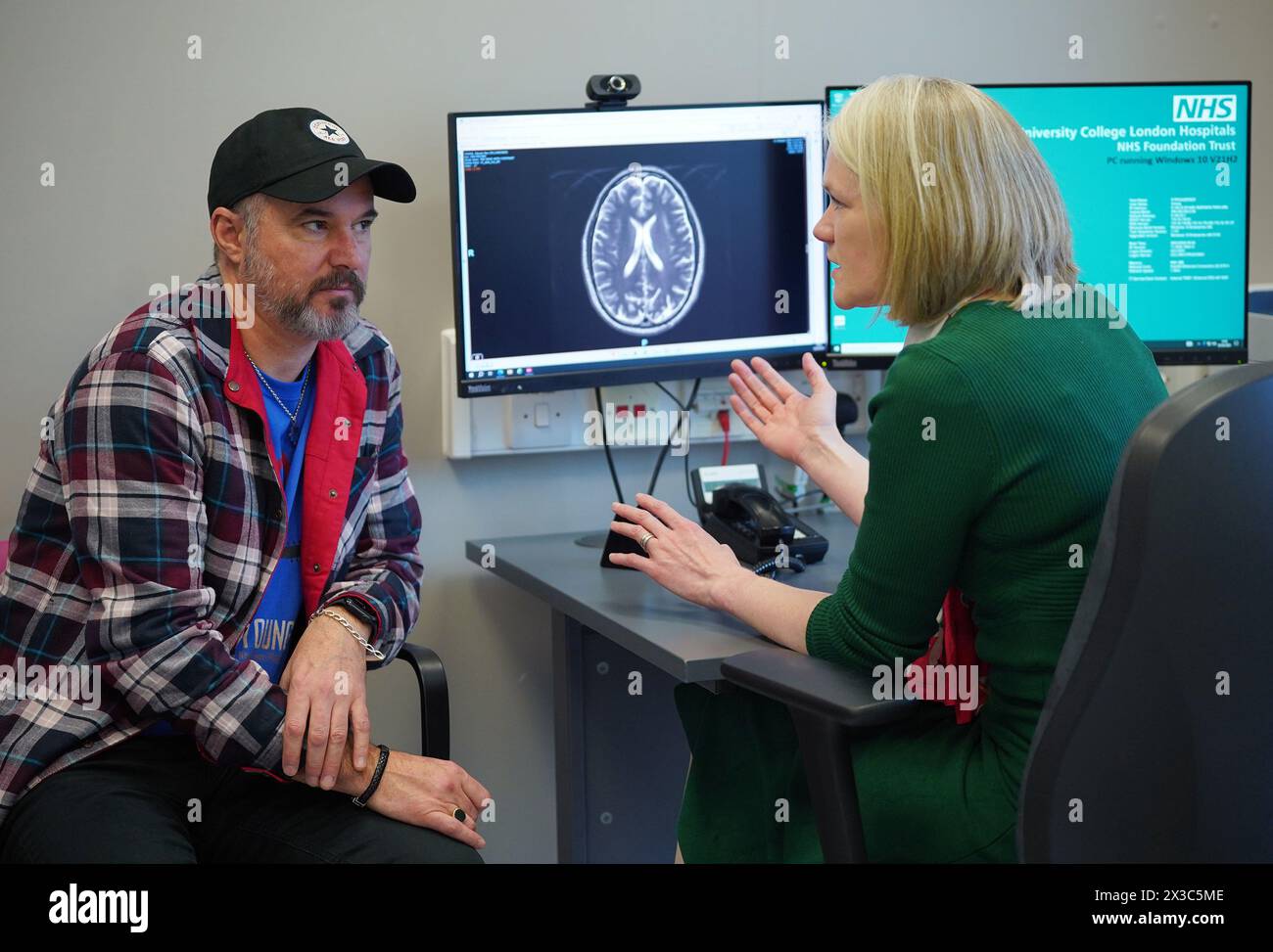 Consultant Dr Heather Shaw speaking to patient Steve Young, with an MRI ...