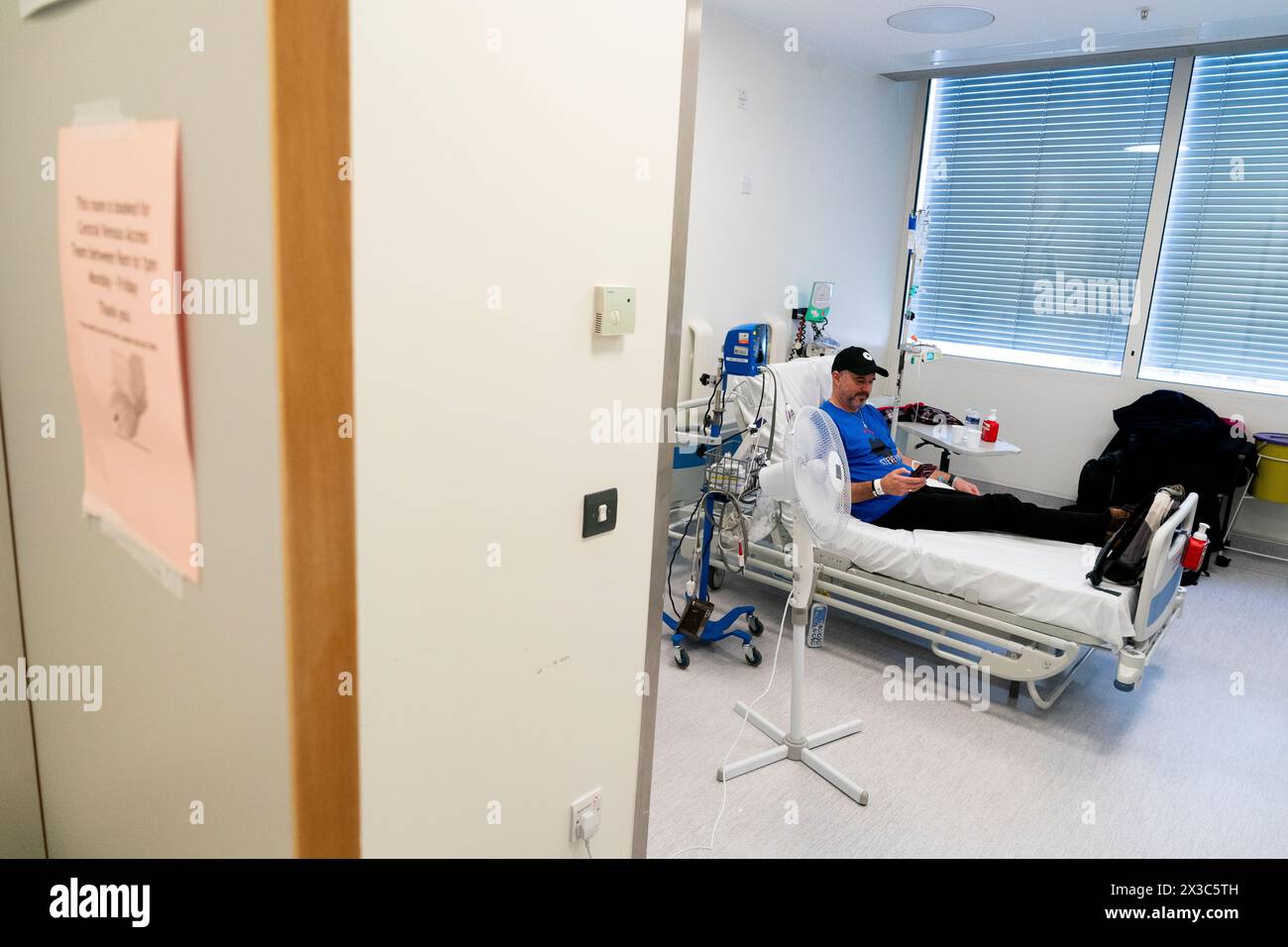 Patient Steve Young waits as infusion is administered, having received ...