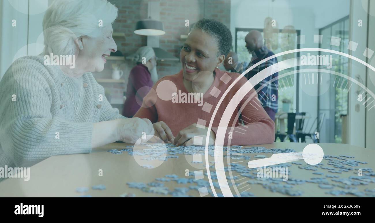 Image of spots of light and clock over diverse senior people doing ...