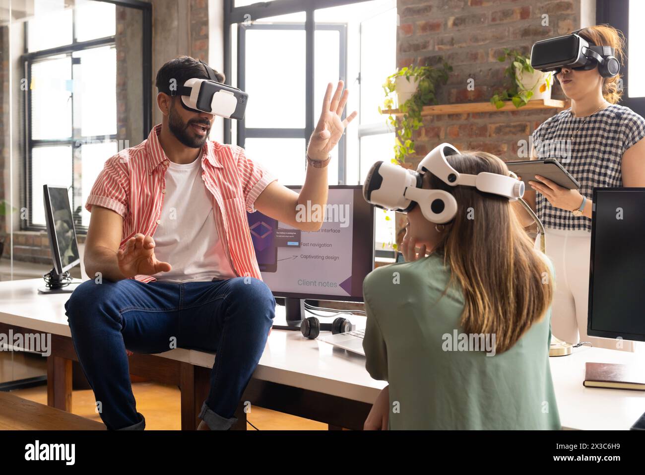 Diverse team in VR headsets explores digital space in a modern office ...