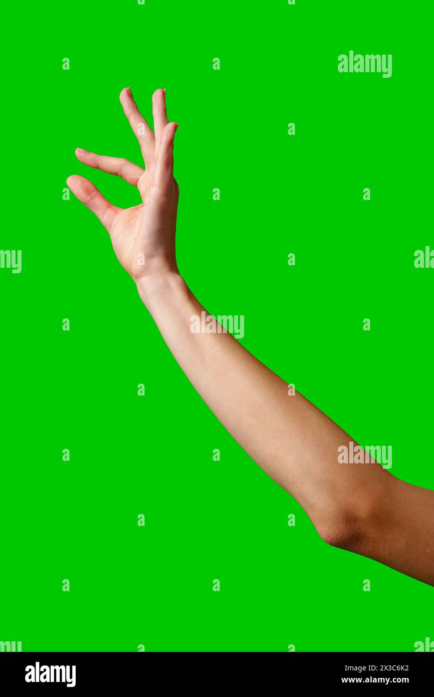 A womans hand extends upward into the air, fingers outstretched ...