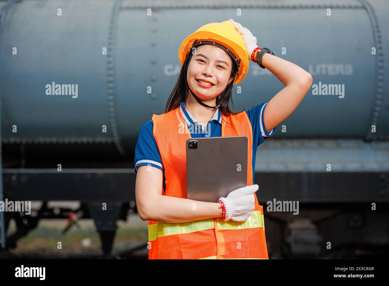 portrait train locomotive engineer women worker. young Asian teen happy smiling enjoy working ...