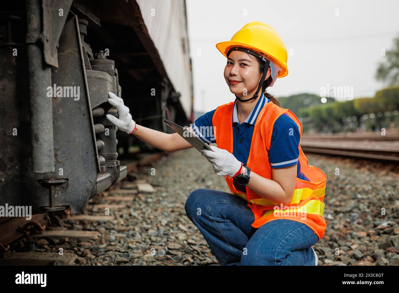 Train locomotive engineer women worker. Young teen Asian working check ...