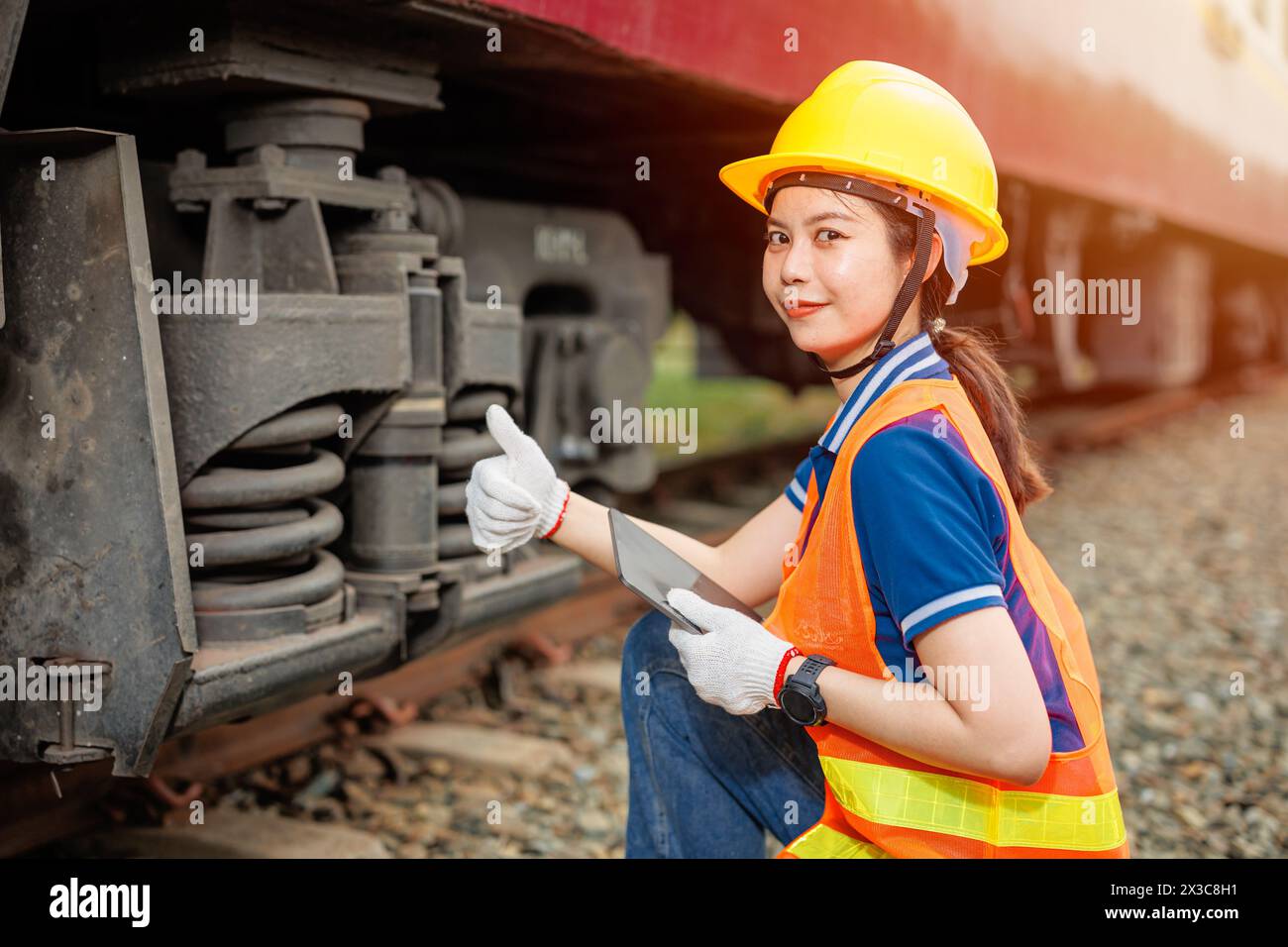 happy engineer women worker check service maintenance train wheel ...