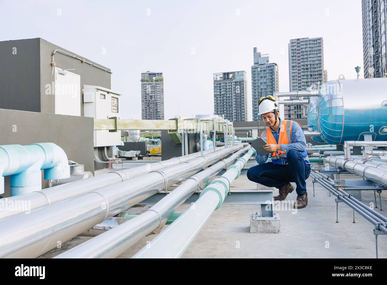 engineer male technician worker working service hotel boiler tank hot ...