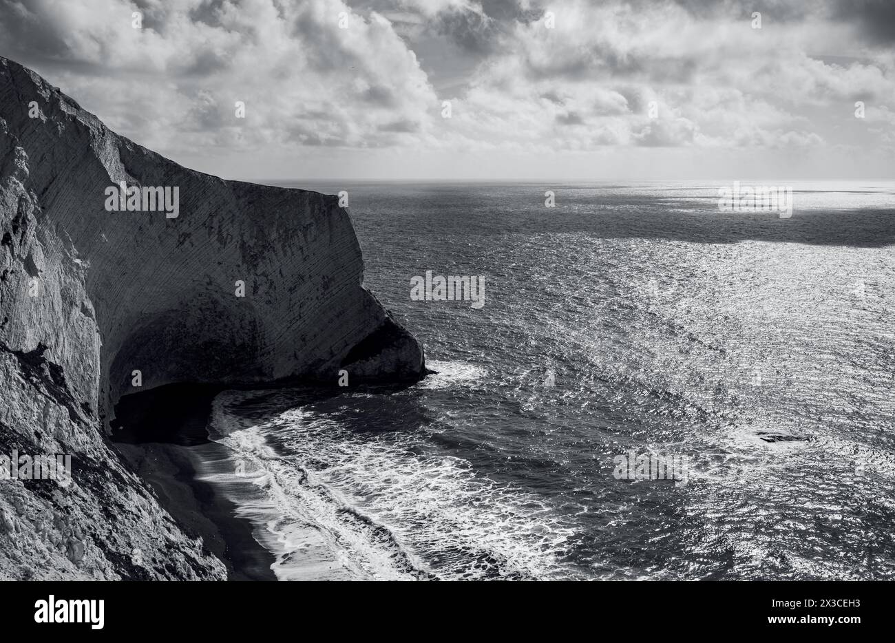 Huge white cliff of chalky rock blocking the beach black and white ...