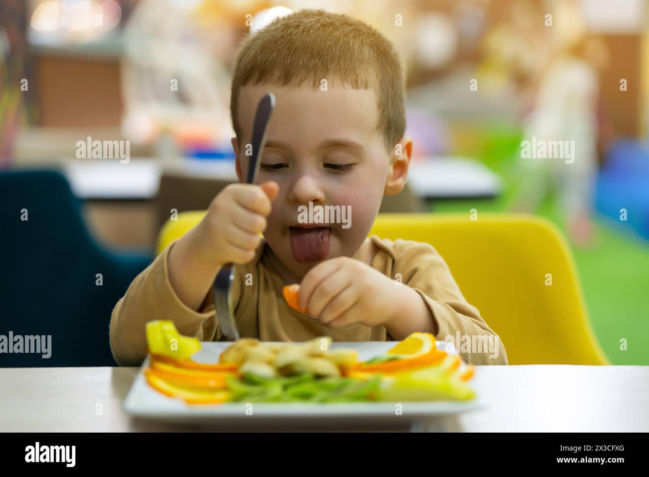 Boy eats in cafe hi-res stock photography and images - Alamy