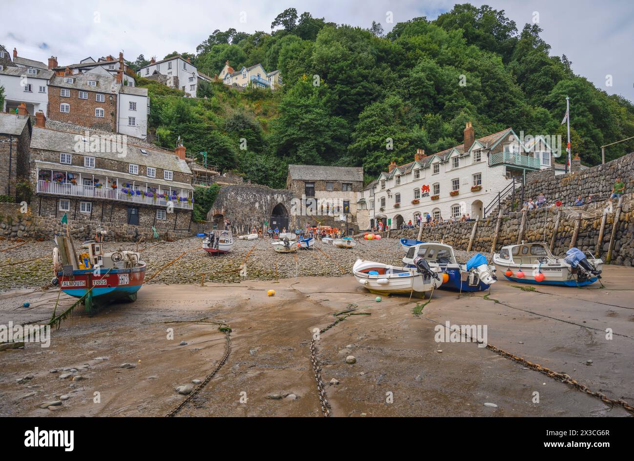 The quaint harbour at low tide in the village of Clovelly in Devon ...