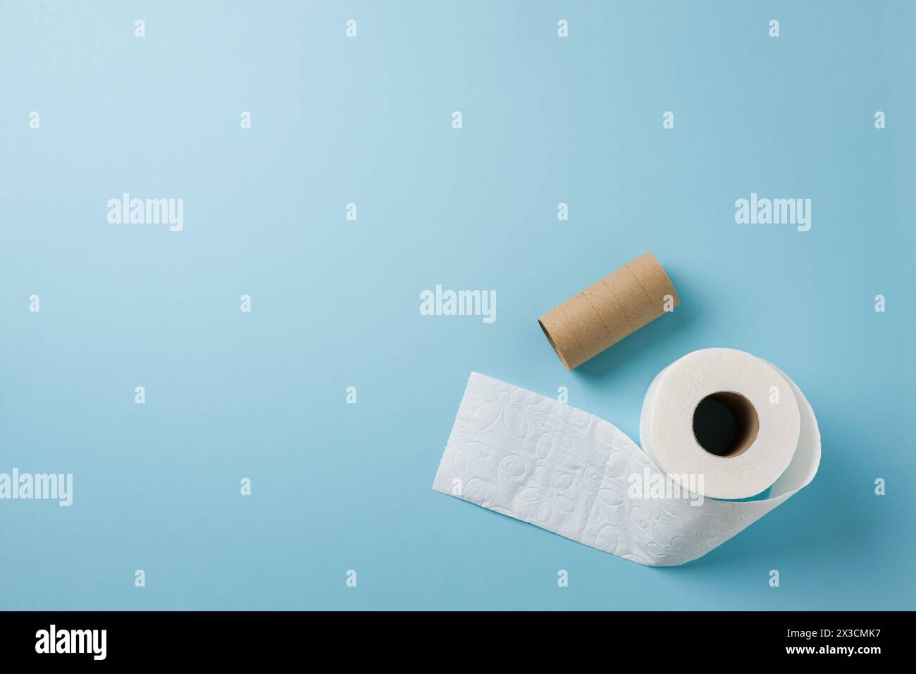 Top view of toilet paper roll on blue background Stock Photo - Alamy