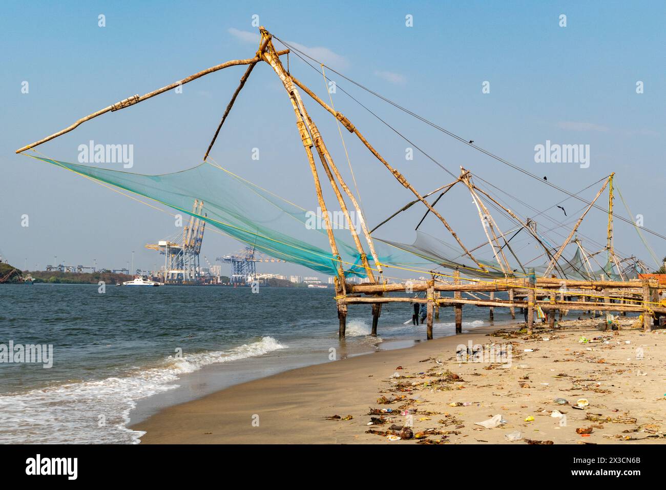 traditional fishing with fishing nets on a wooden scaffold at the sea ...