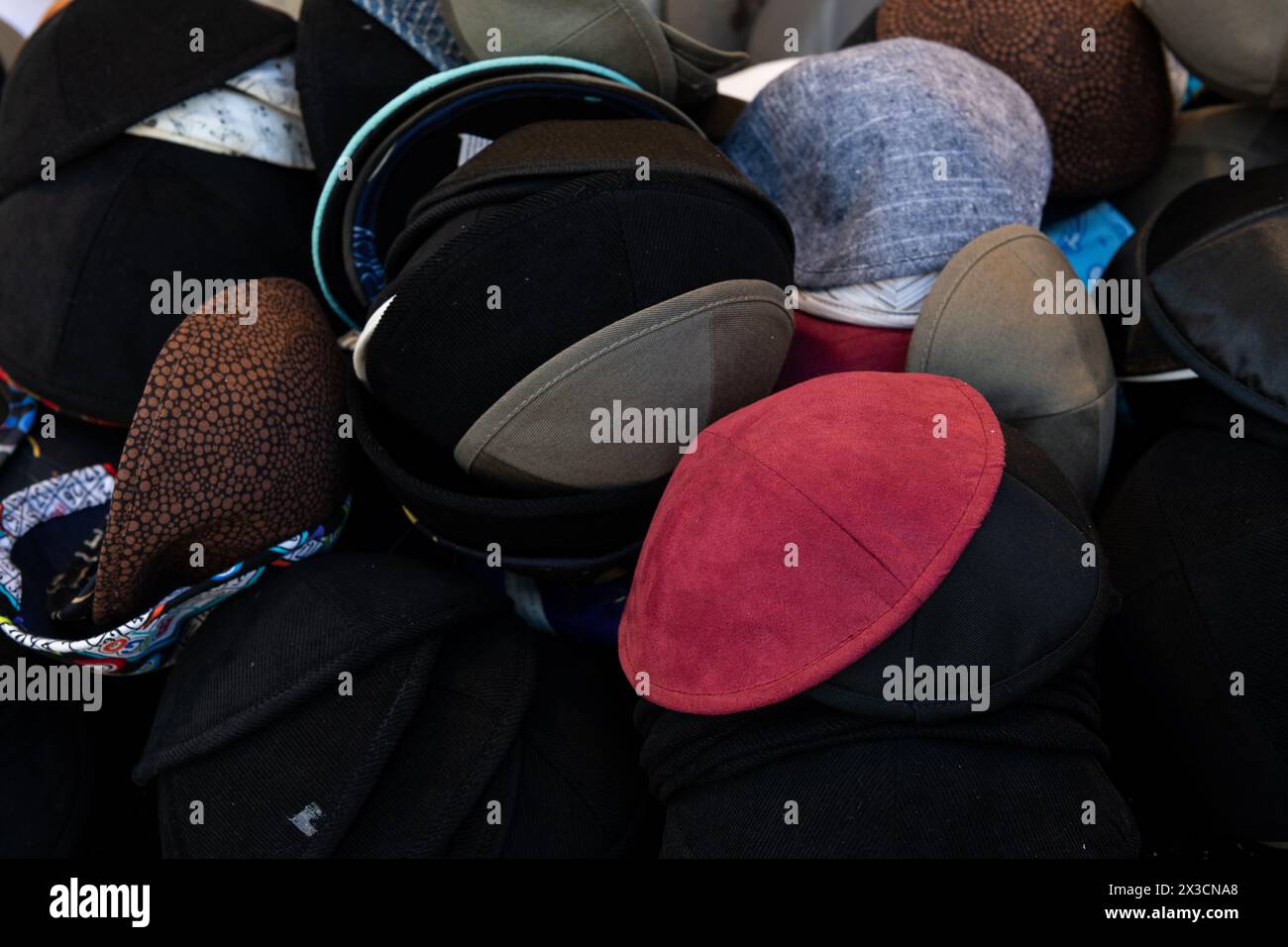 Colorful, patterned variety of yarmulkes or skull caps, worn by ...