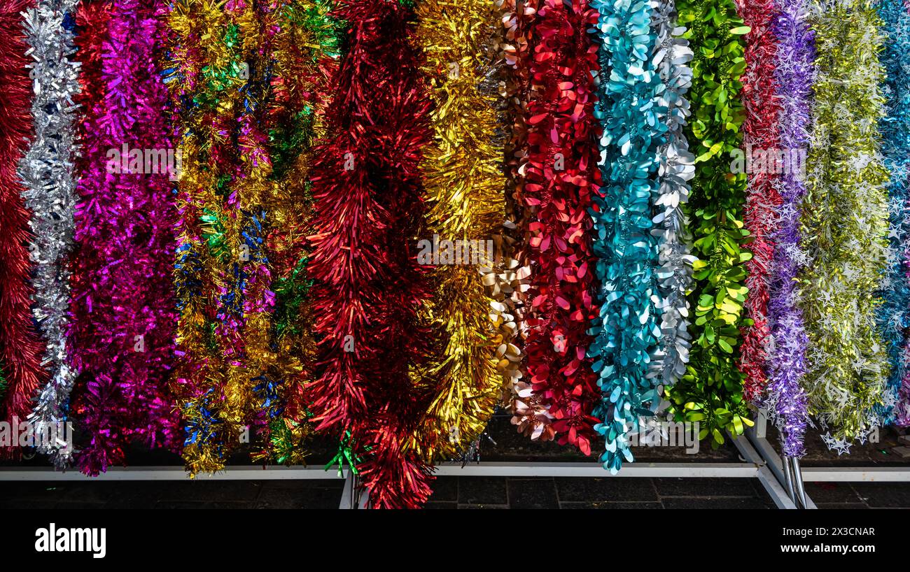 Strings of colorful, foil tinsel sold for decorating the sukkah, a ...