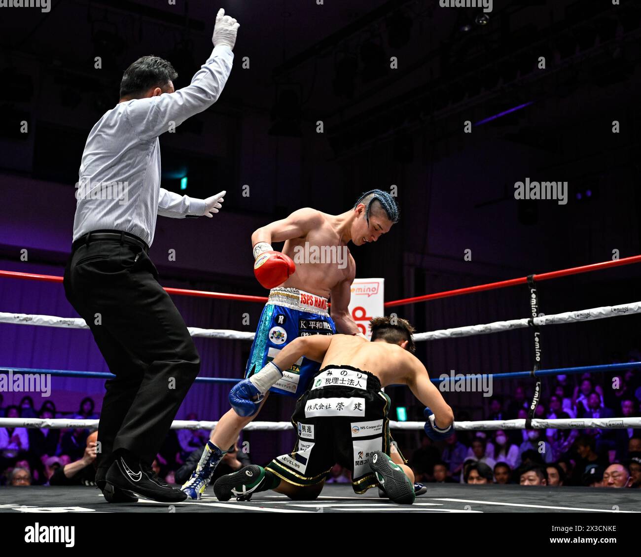 Tokyo, Japan. 25th Apr, 2024. Referee Takeru Okaniwa steps in between ...