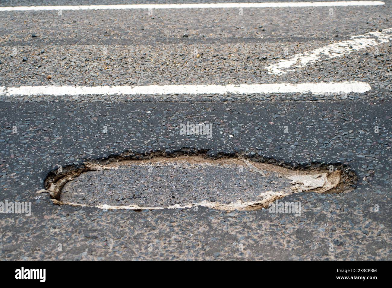 Iver Heath, Buckinghamshire, UK. 21st April, 2024. Potholes on a failed ...