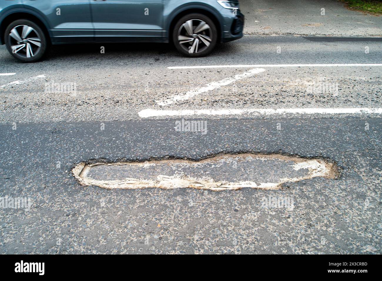 Iver Heath, Buckinghamshire, UK. 21st April, 2024. Potholes on a failed ...