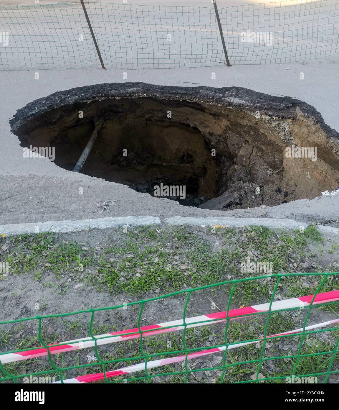 Big hole on the asphalt road Stock Photo - Alamy