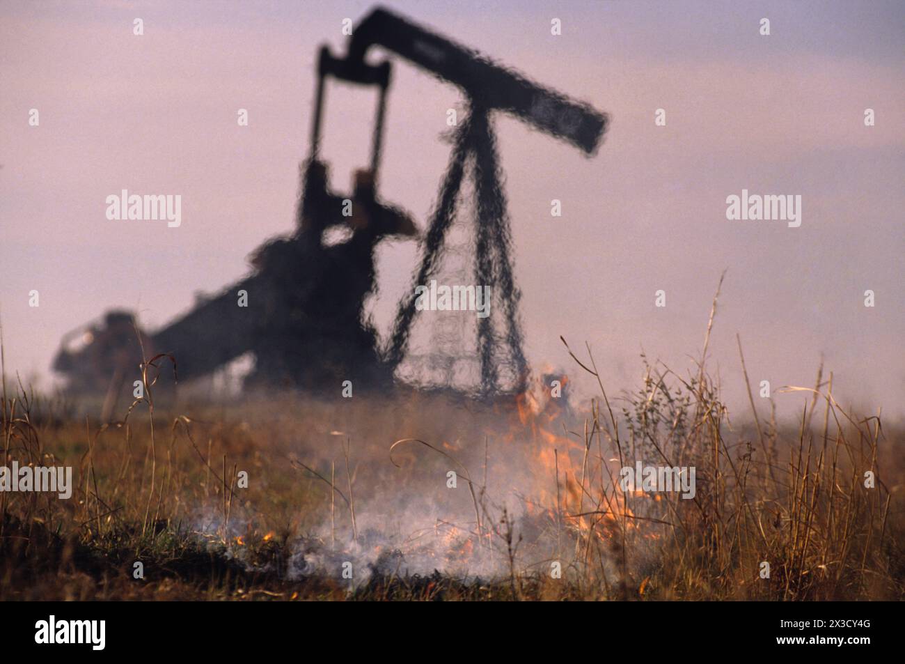 Oil Field with Fire Stock Photo - Alamy