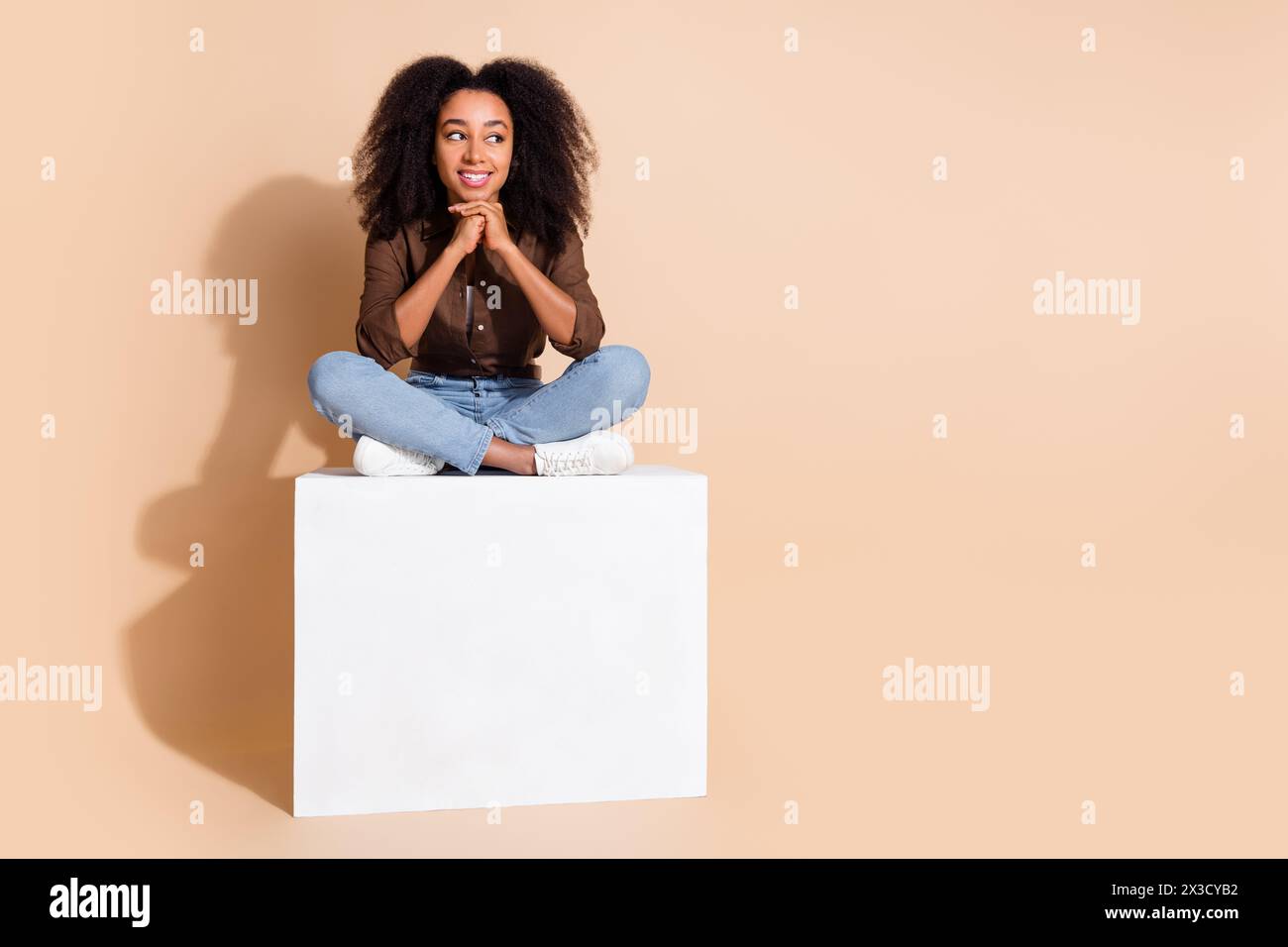 Full length photo of dreamy ncie girl wear brown blouse sit on platform ...