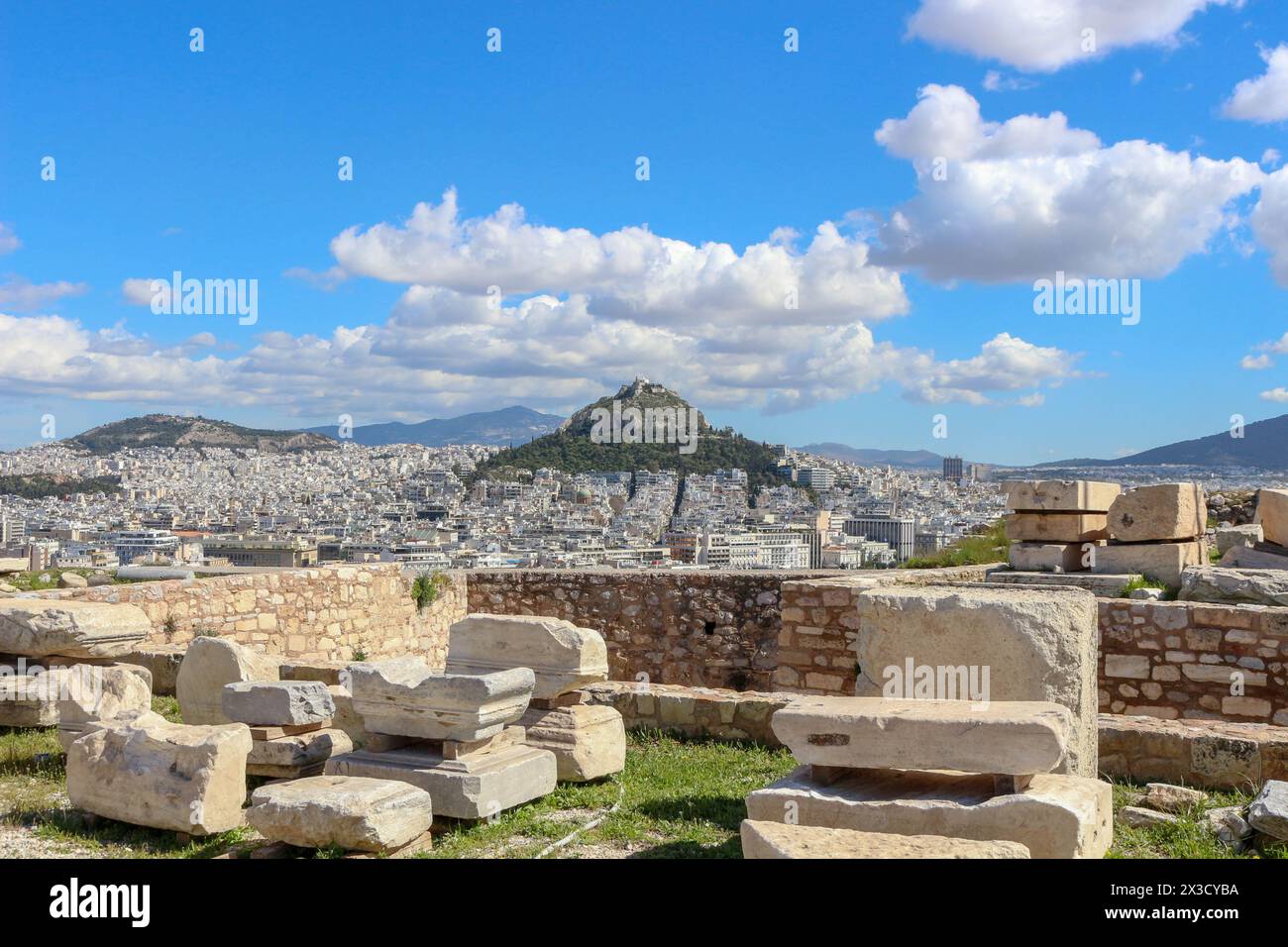 Gaze upon the stunning vista of Lycabettus Hill from the elevated vantage point of the Acropolis ...