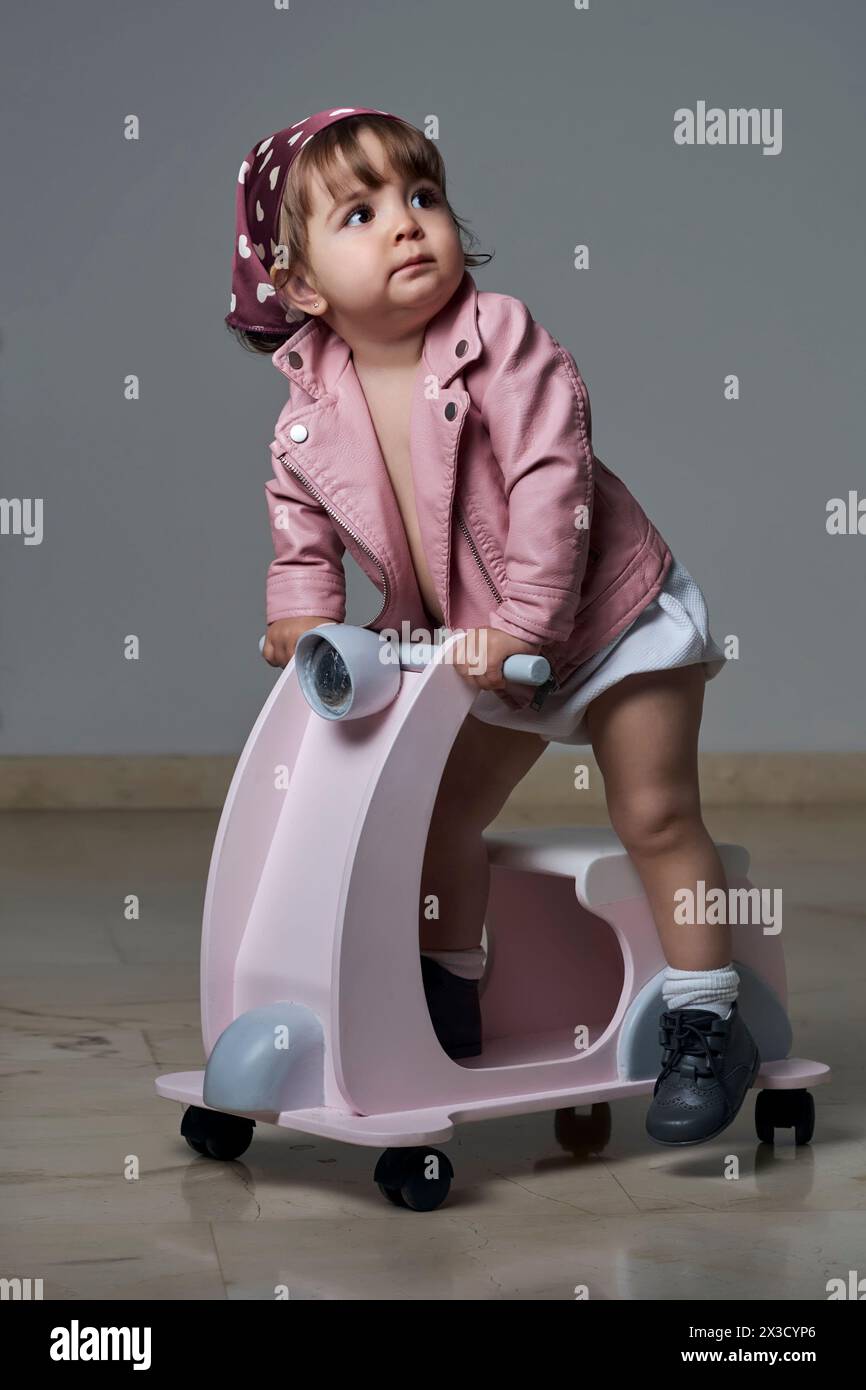A baby driving a motorcycle Stock Photo - Alamy