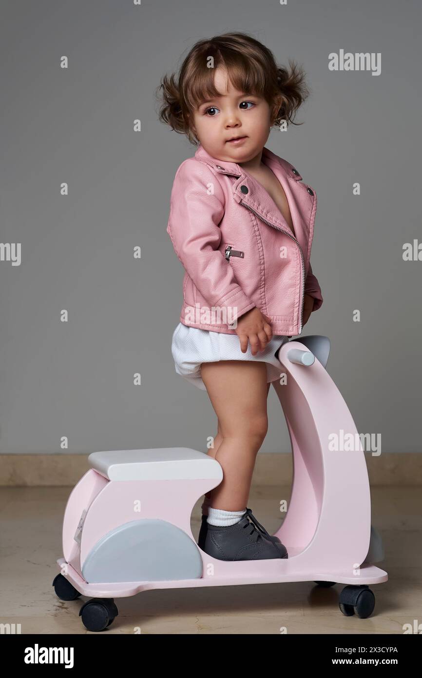 A baby driving a motorcycle Stock Photo - Alamy