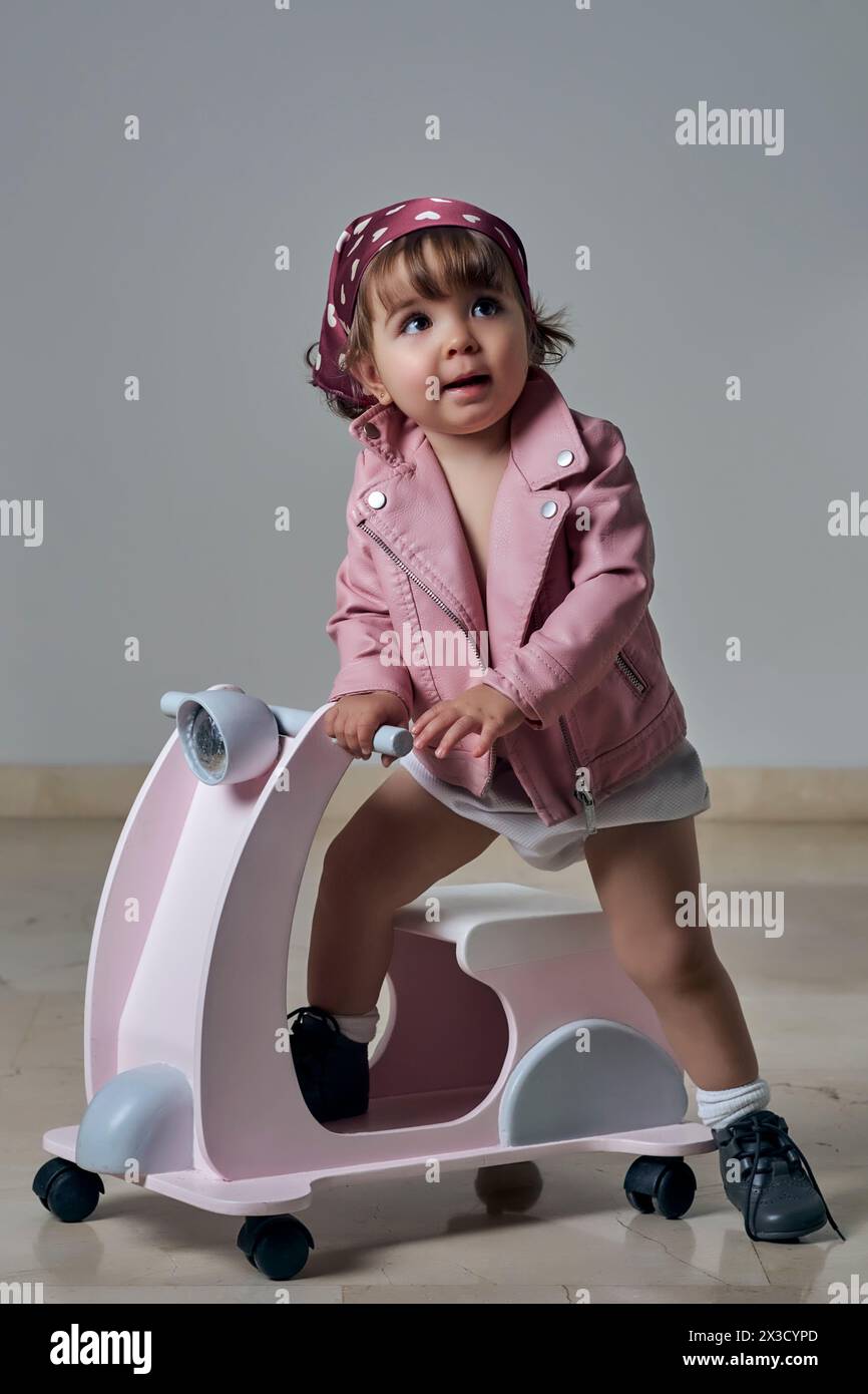 A baby driving a motorcycle Stock Photo - Alamy