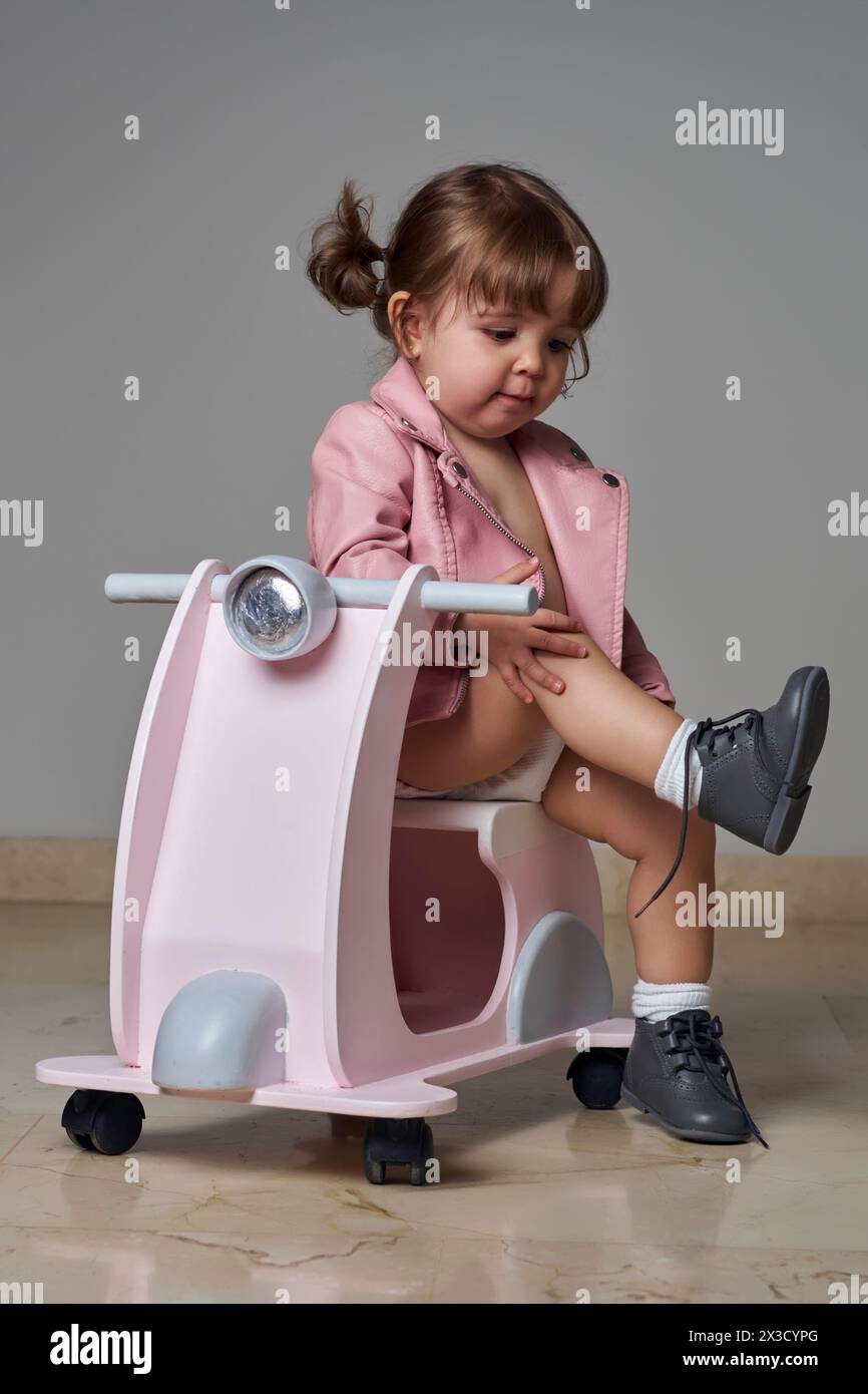 A baby driving a motorcycle Stock Photo - Alamy