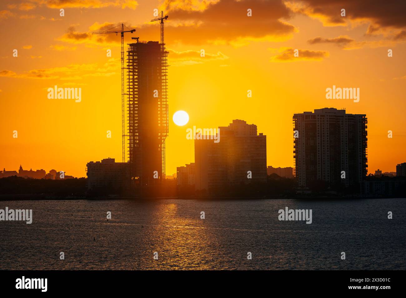 sunset over the city sun buildings in construction miami Stock Photo ...