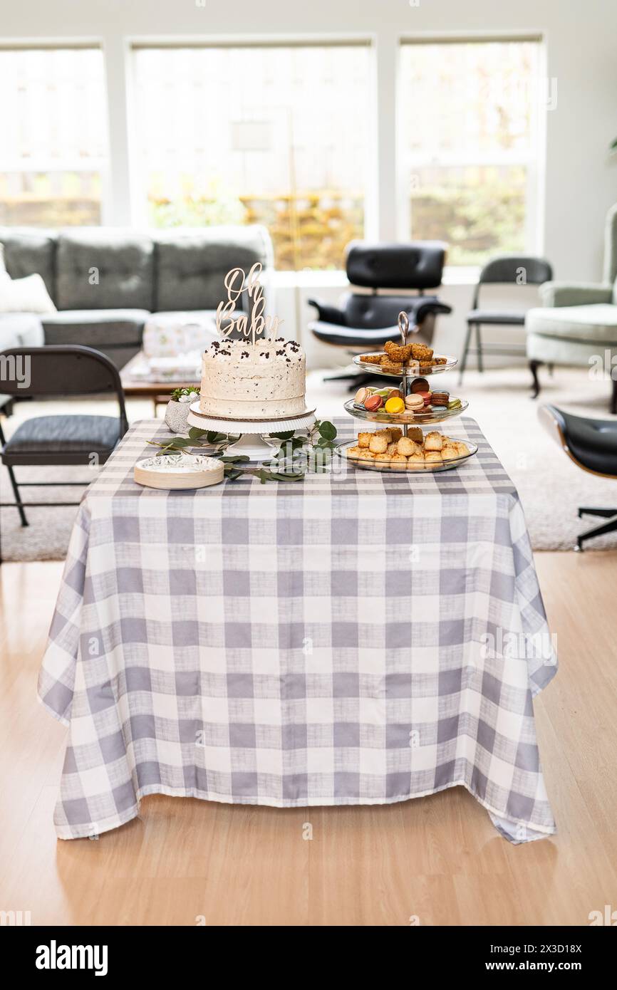Baby shower cake and dessert table setup in elegant home Stock Photo ...