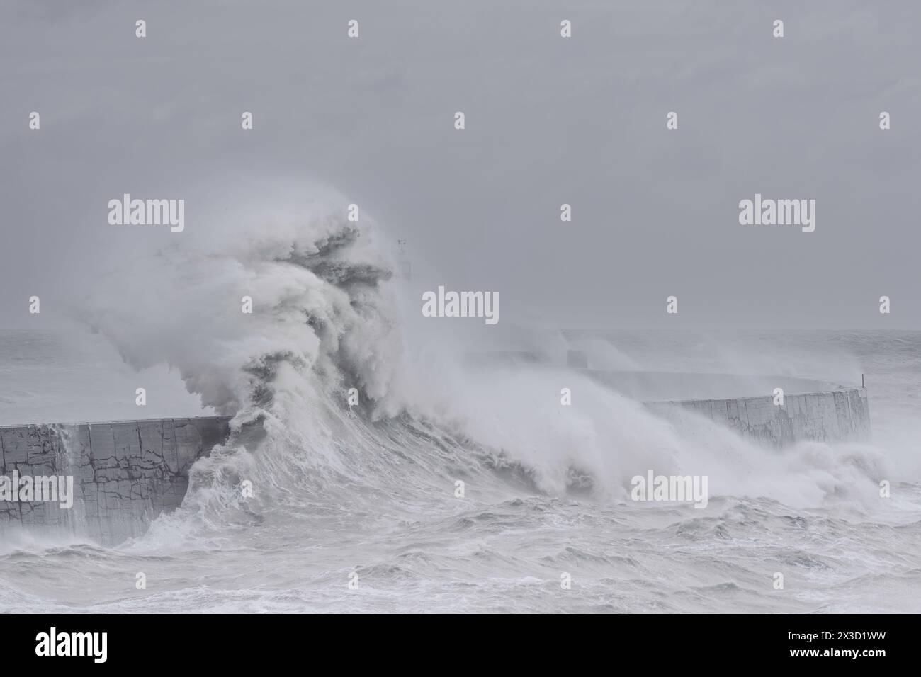 A ferocious spring storm, batters the harbour wall at Newhaven on the ...