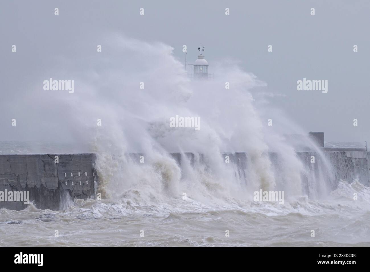 A ferocious spring storm, batters the harbour wall at Newhaven on the ...