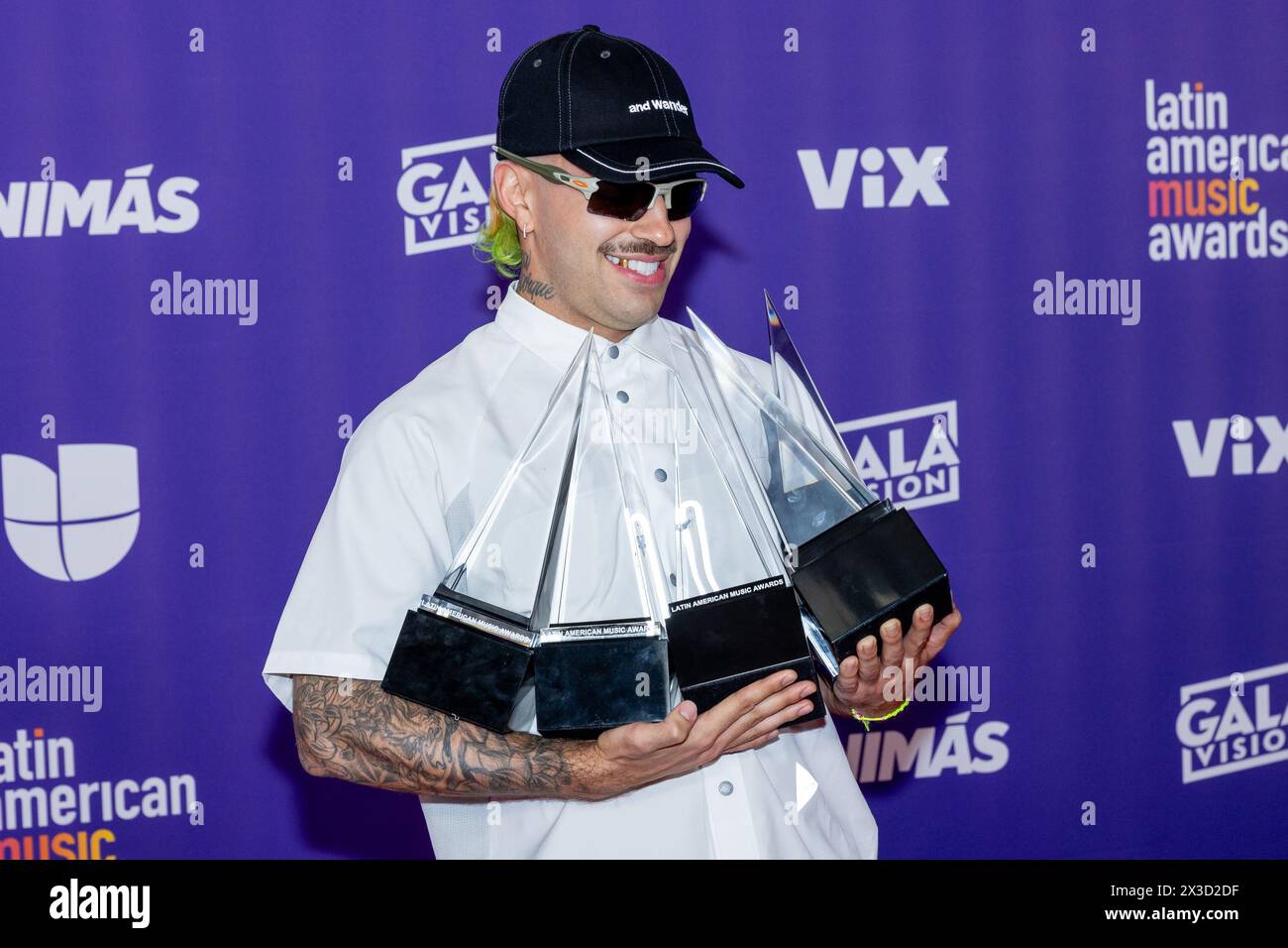 Las Vegas, USA. 25th Apr, 2024. Feid shows off his awards at the 2024 ...