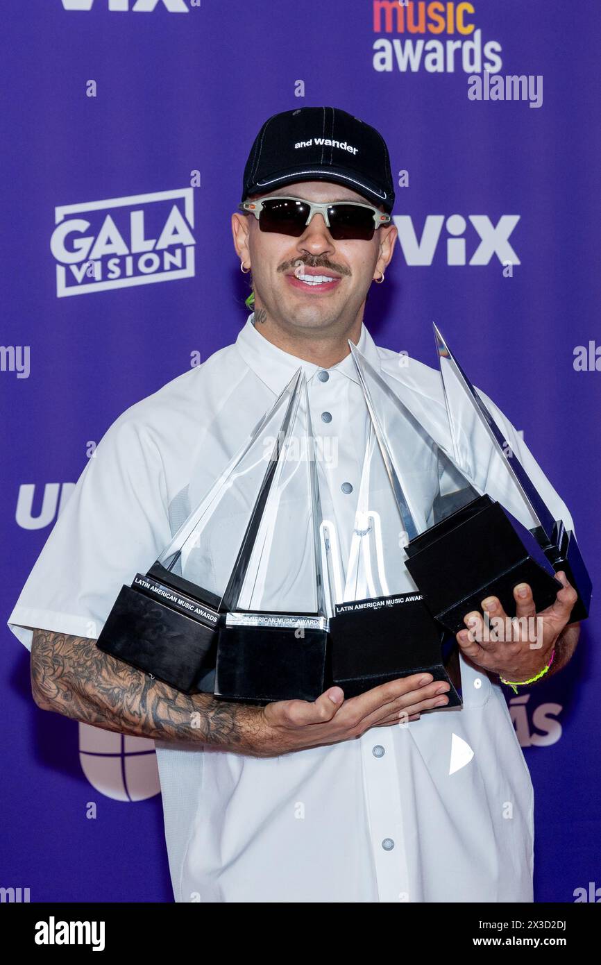Las Vegas, USA. 25th Apr, 2024. Feid shows off his awards at the 2024 ...