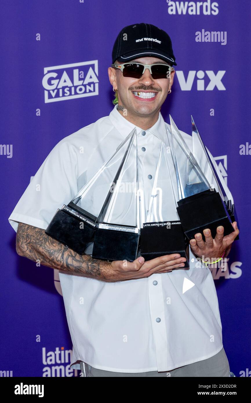 Las Vegas, USA. 25th Apr, 2024. Feid shows off his awards at the 2024 ...