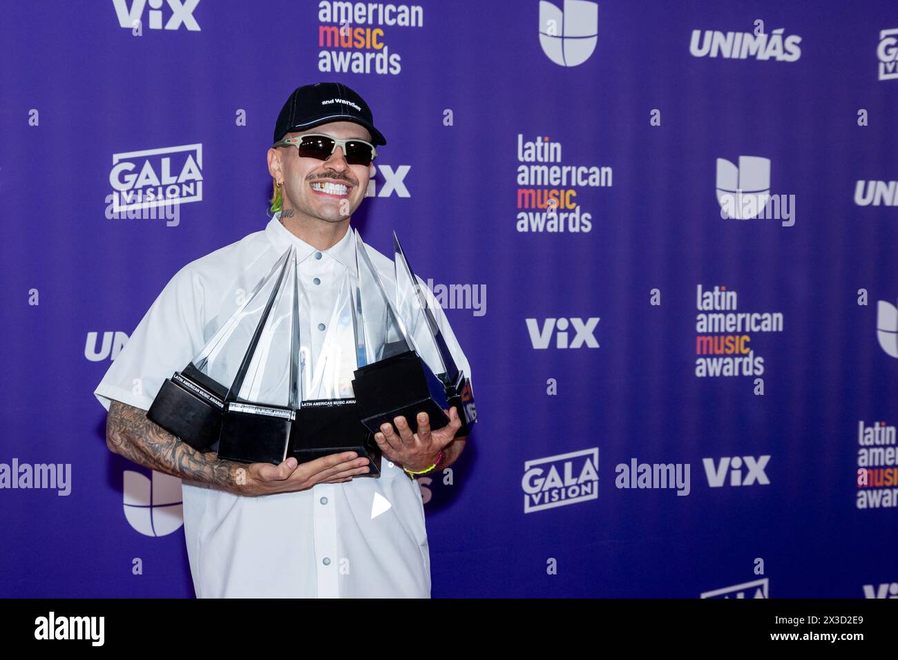 Las Vegas, USA. 25th Apr, 2024. Feid shows off his awards at the 2024 ...